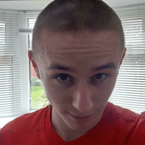Football captain Sam shaves head for charity